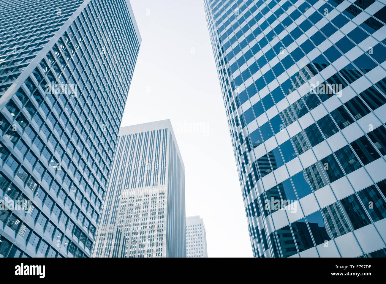 View of modern blue colored building made of glass Stock Photo - Alamy