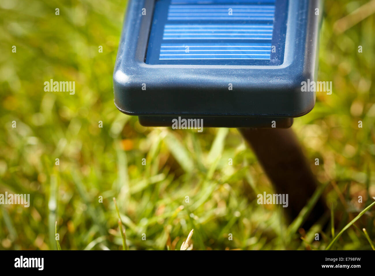 solar panel grass energy Stock Photo - Alamy