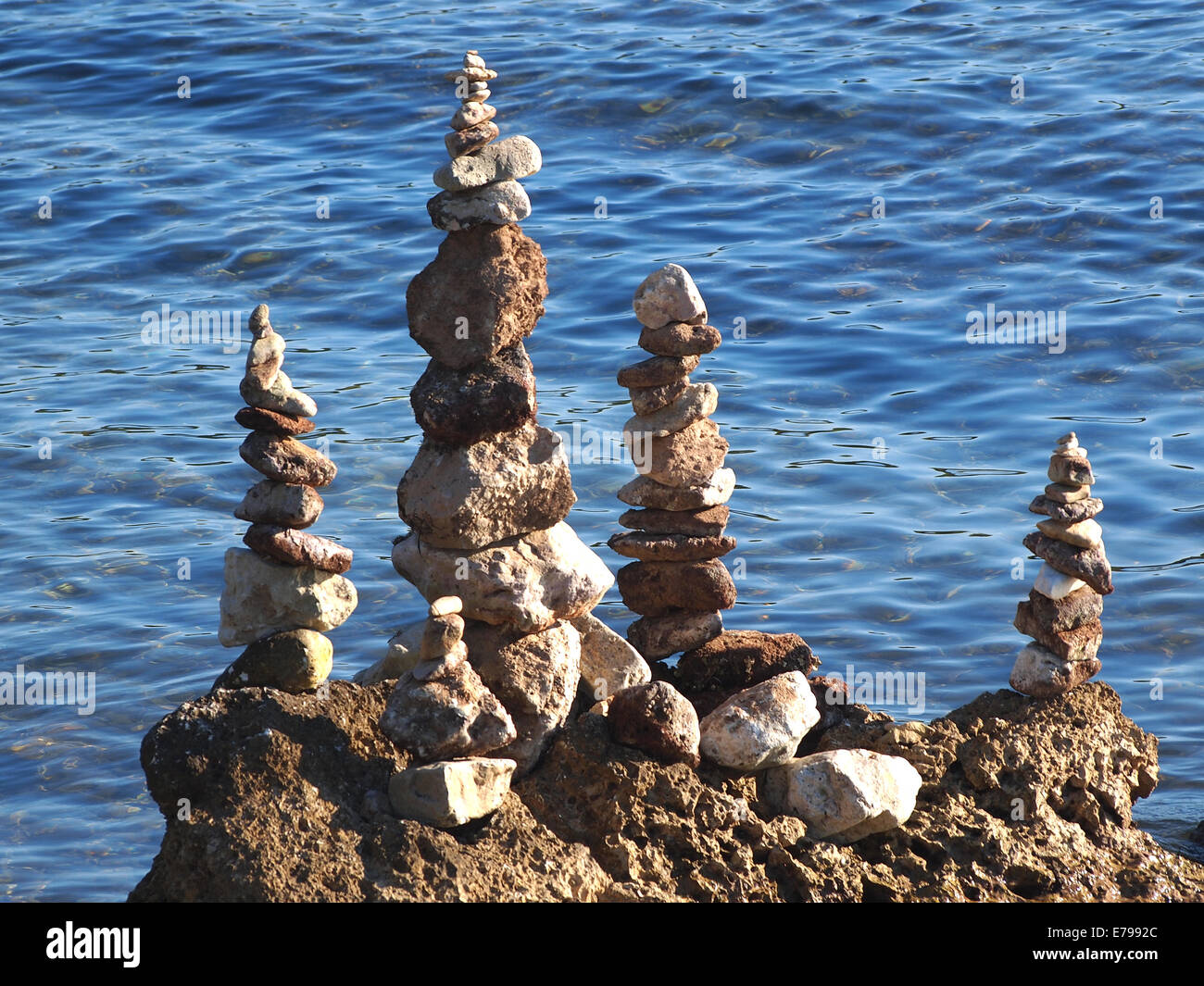 Stack of round stones on a seashore Stock Photo - Alamy
