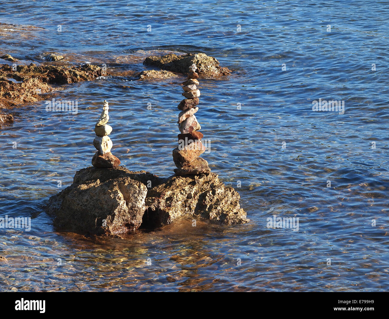 Stack of round stones on a seashore Stock Photo - Alamy