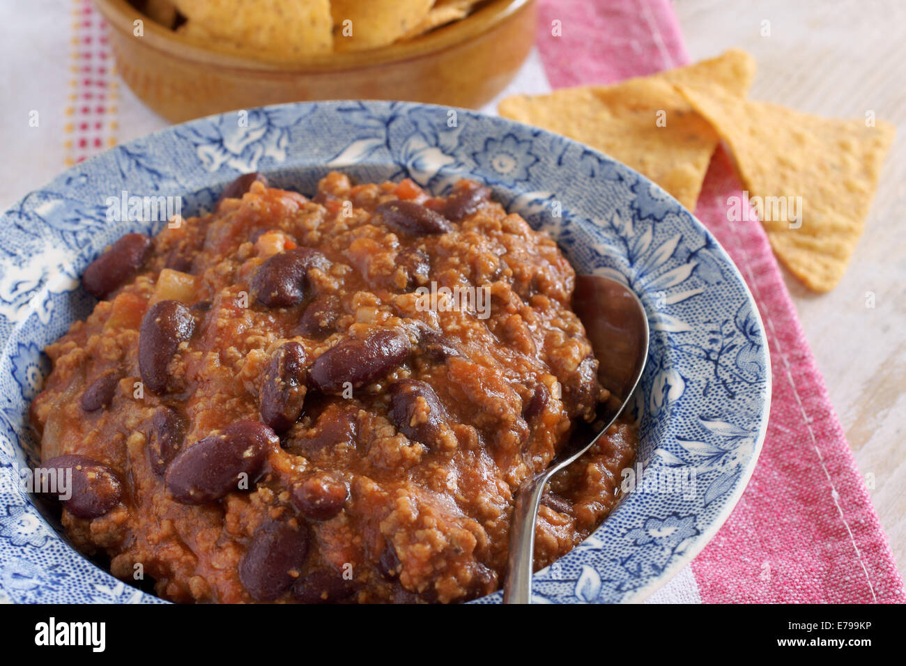 Chilli con Carne served with tortilla chips Stock Photo - Alamy