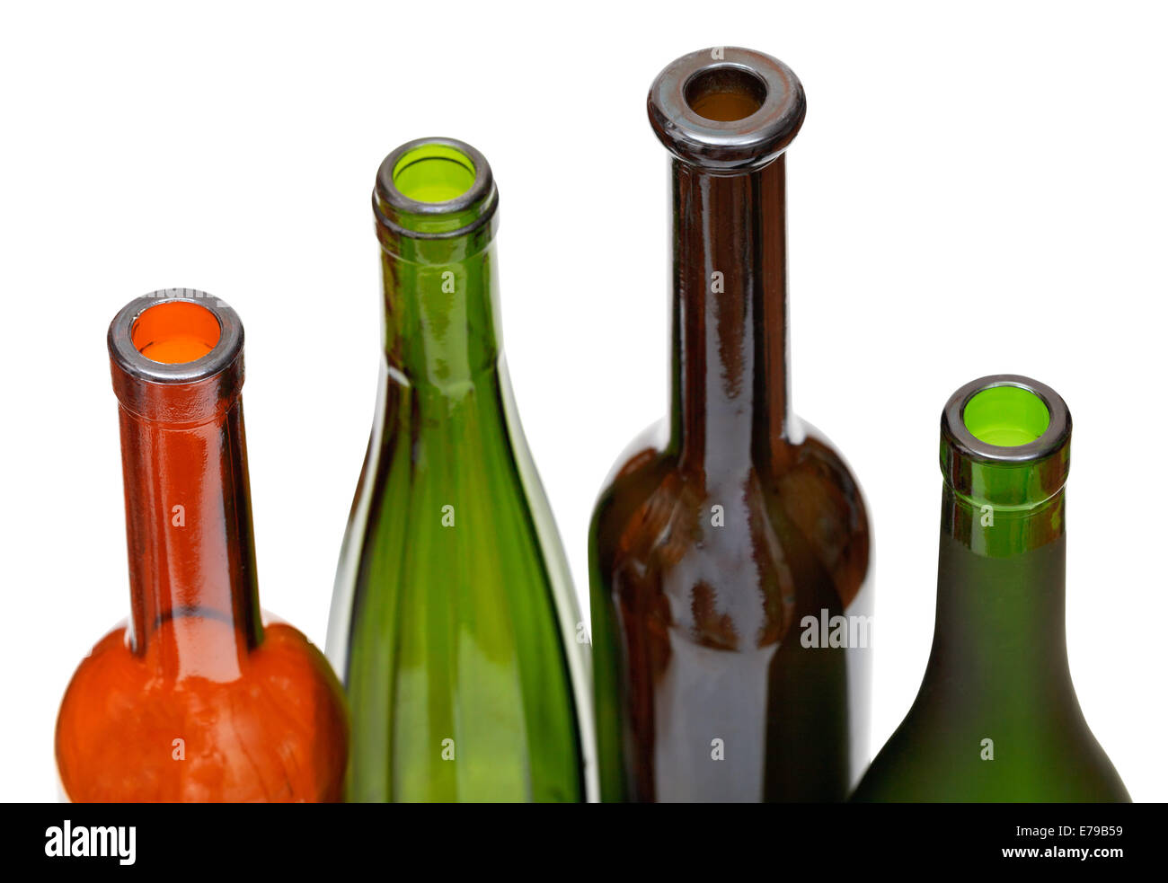 bottlenecks of few colored wine bottles close up isolated on white ...