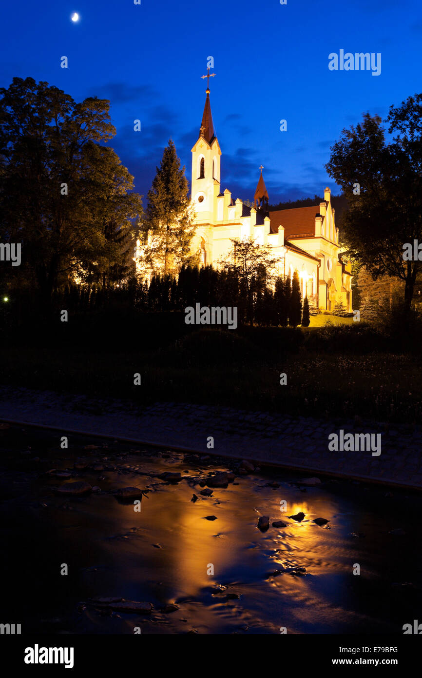 Church in Rymanow Zdroj, Poland. Evening time Stock Photo - Alamy