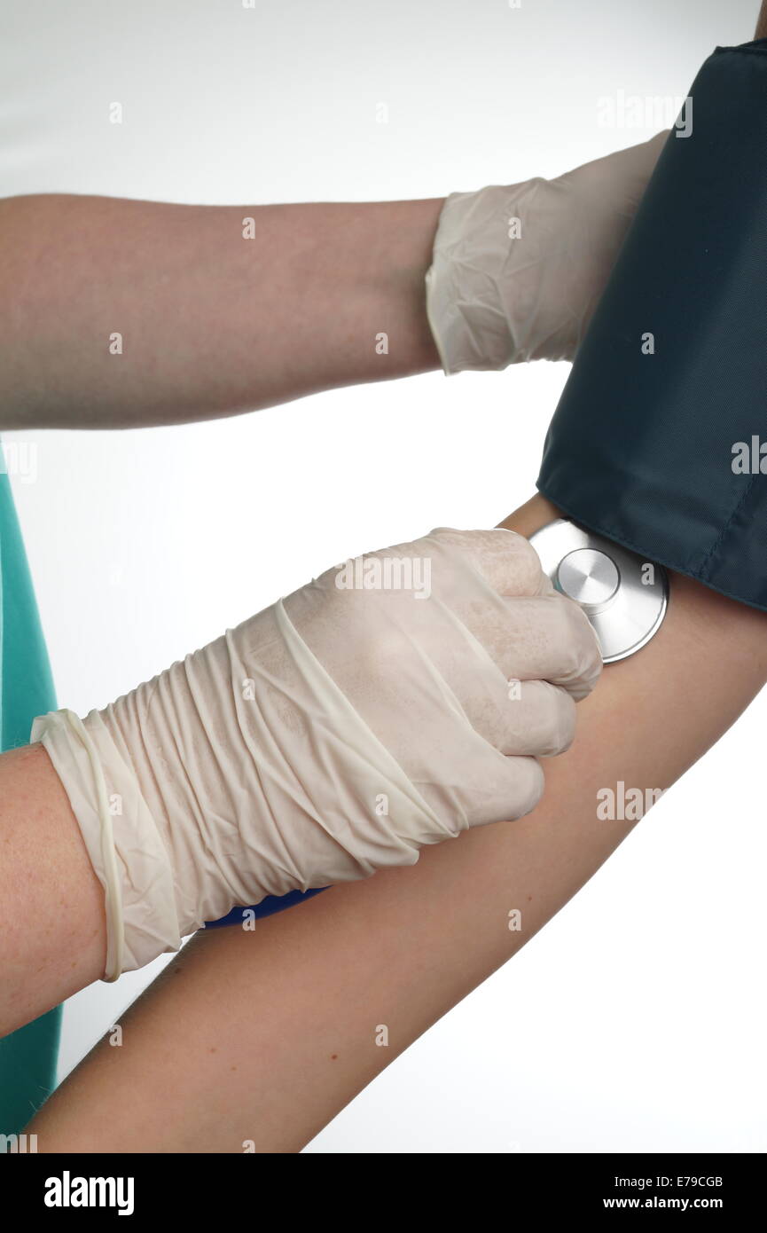 blood pressure measurement on the upper arm. Stethoscope Stock Photo ...