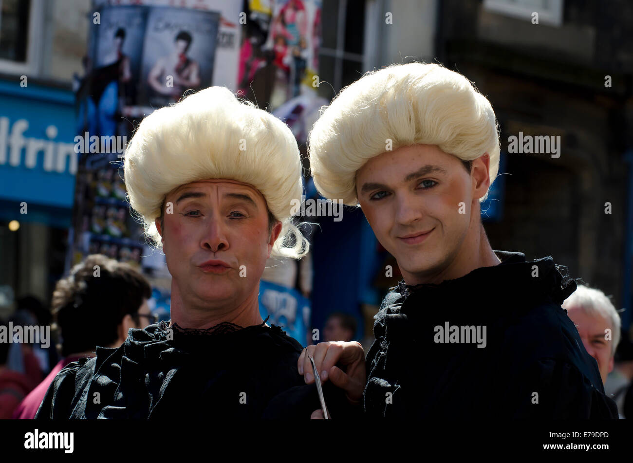 Two men dressed as posh women promoting a show at the annual Festival ...