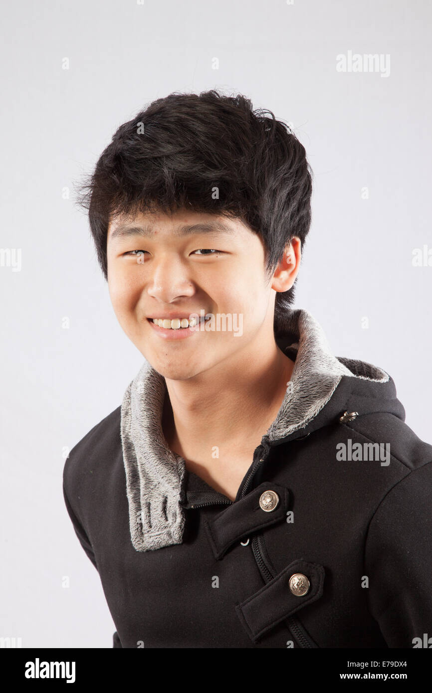 Happy asian man sitting hi-res stock photography and images - Alamy