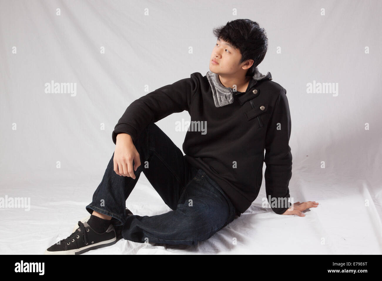 Handsome man sitting floor hi-res stock photography and images - Alamy