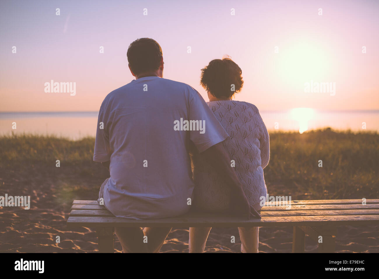 Senior couple enjoy the sunset together Stock Photo - Alamy