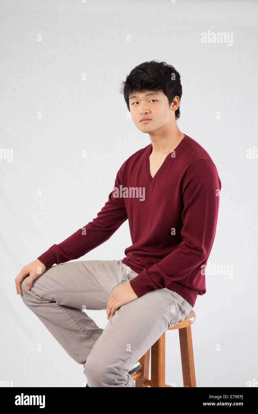 Asian man looking thoughtful Stock Photo - Alamy