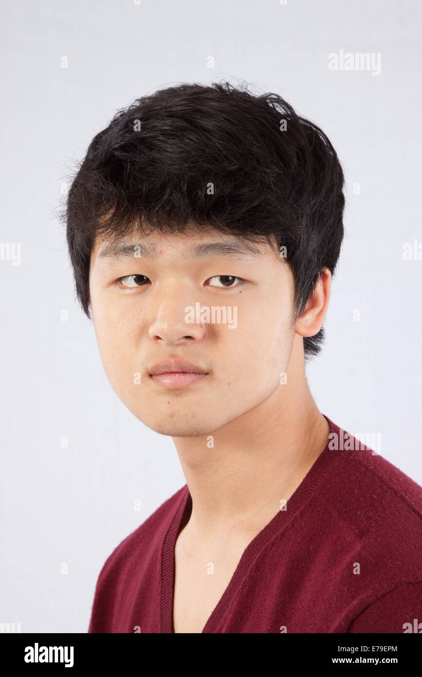 Asian man looking thoughtful Stock Photo - Alamy