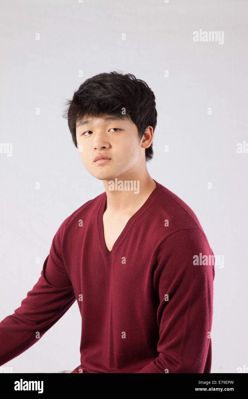 Asian man looking thoughtful Stock Photo - Alamy