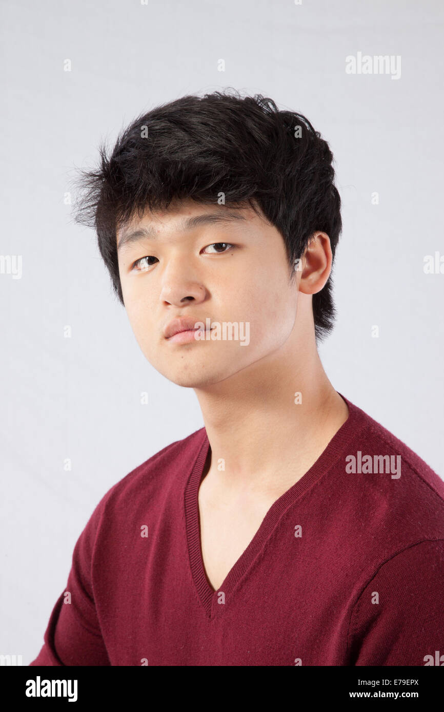 Asian man looking thoughtful Stock Photo - Alamy