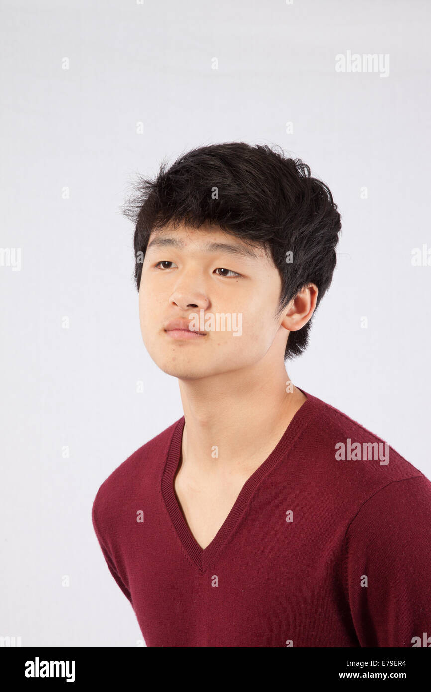 Asian man looking thoughtful Stock Photo - Alamy