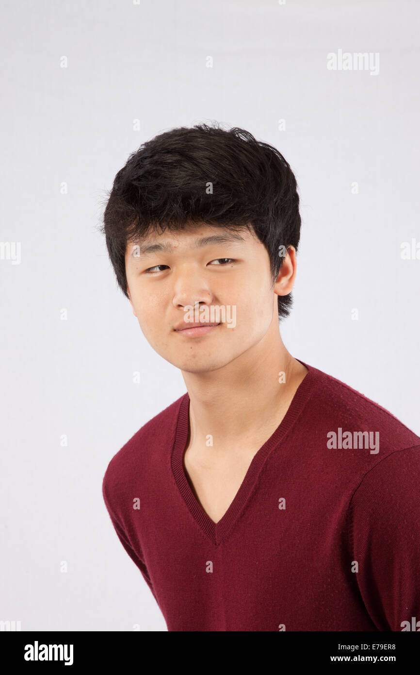 Asian man looking thoughtful Stock Photo - Alamy