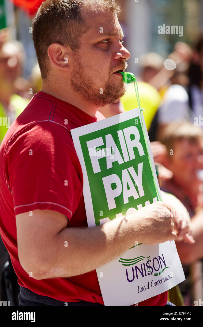 Man holds official Unison fair pay protest board Stock Photo - Alamy