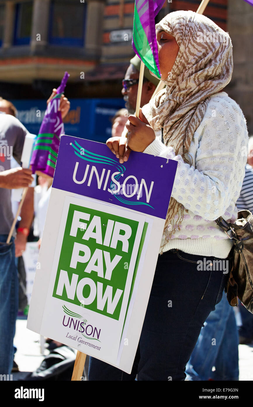 Woman holding unison protest board Stock Photo - Alamy