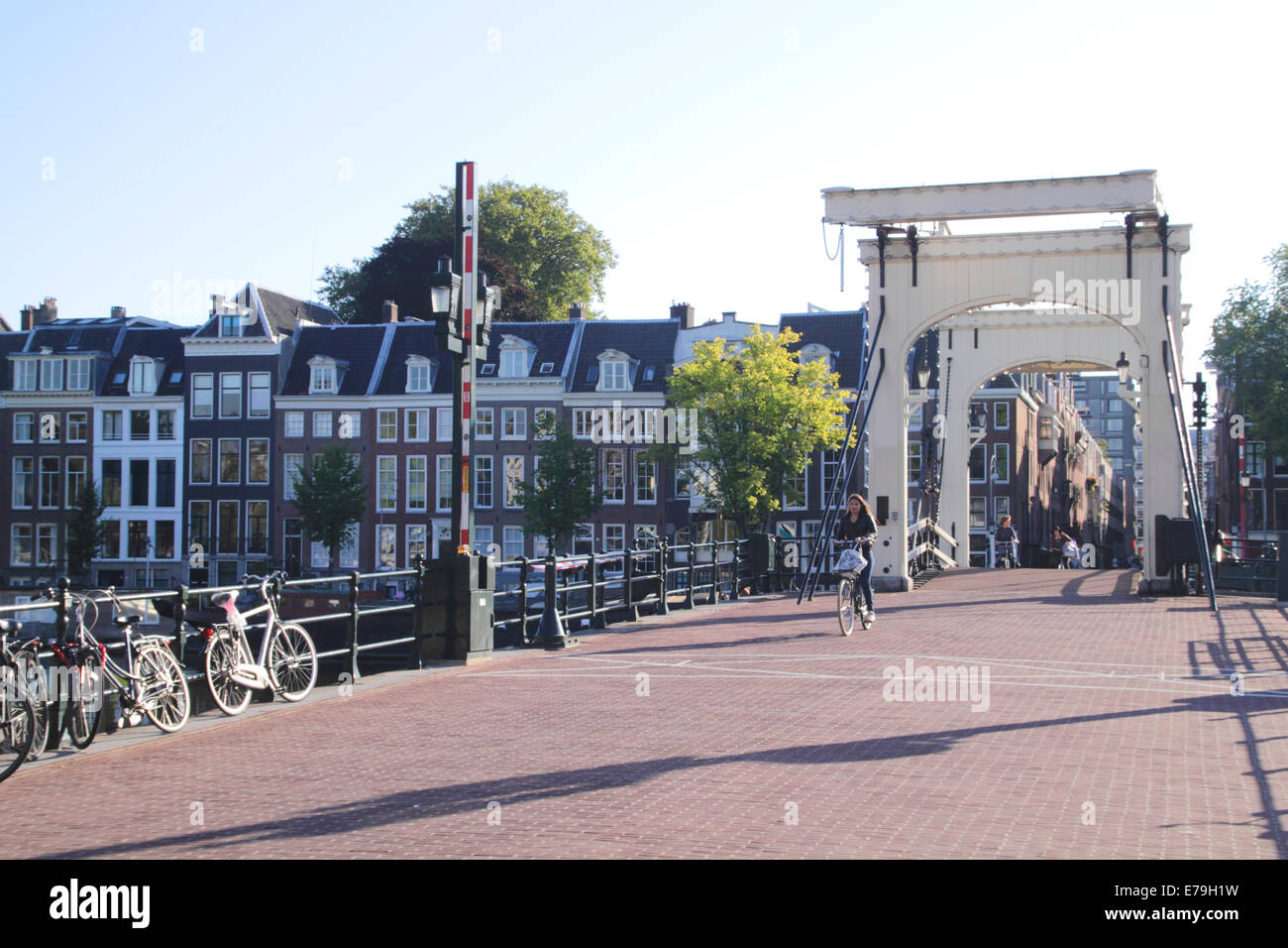 Crossing the Magere Bruge drawbridge Amsterdam Holland Stock Photo - Alamy