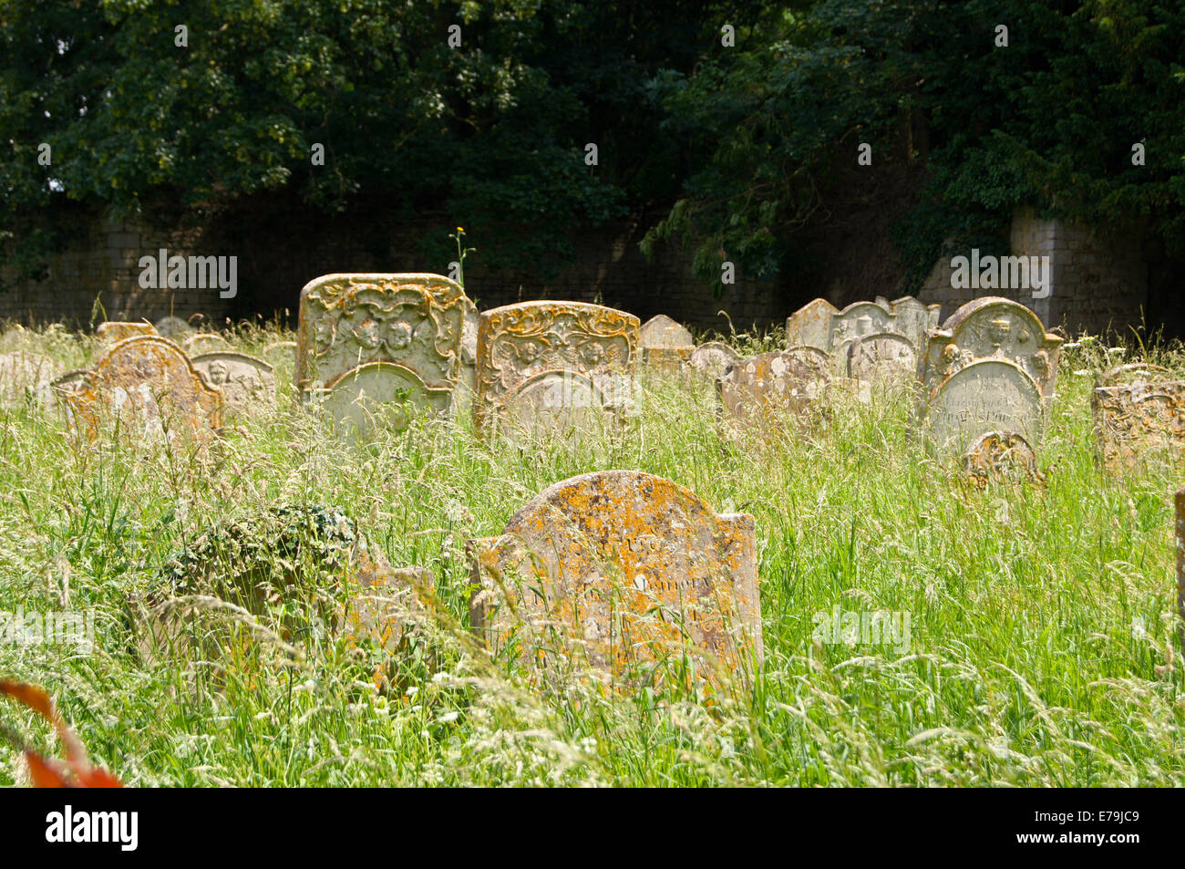 Gravestones in the churchyard of St. Thomas a Becket church, Ramsey ...