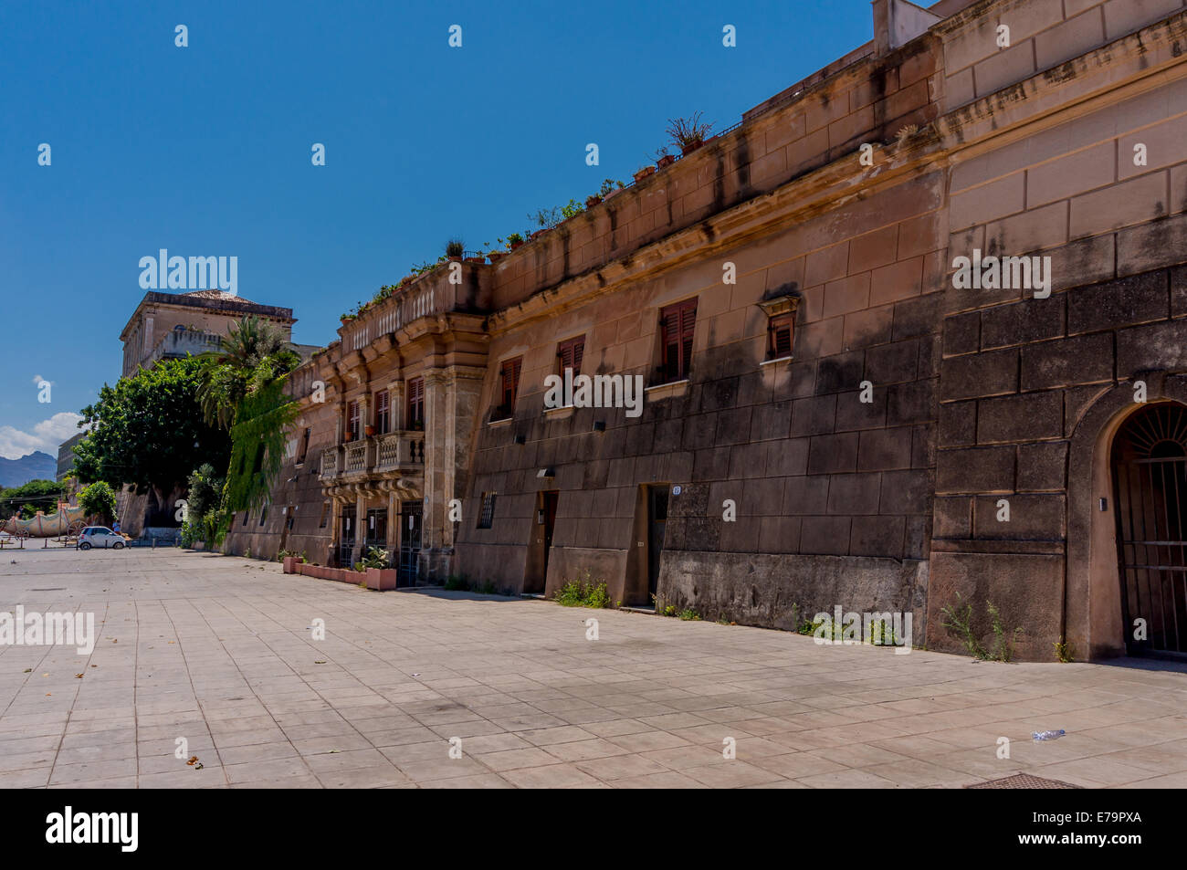 Tarnished old buildings by the seafront in Palermo, Sicily, built in a ...