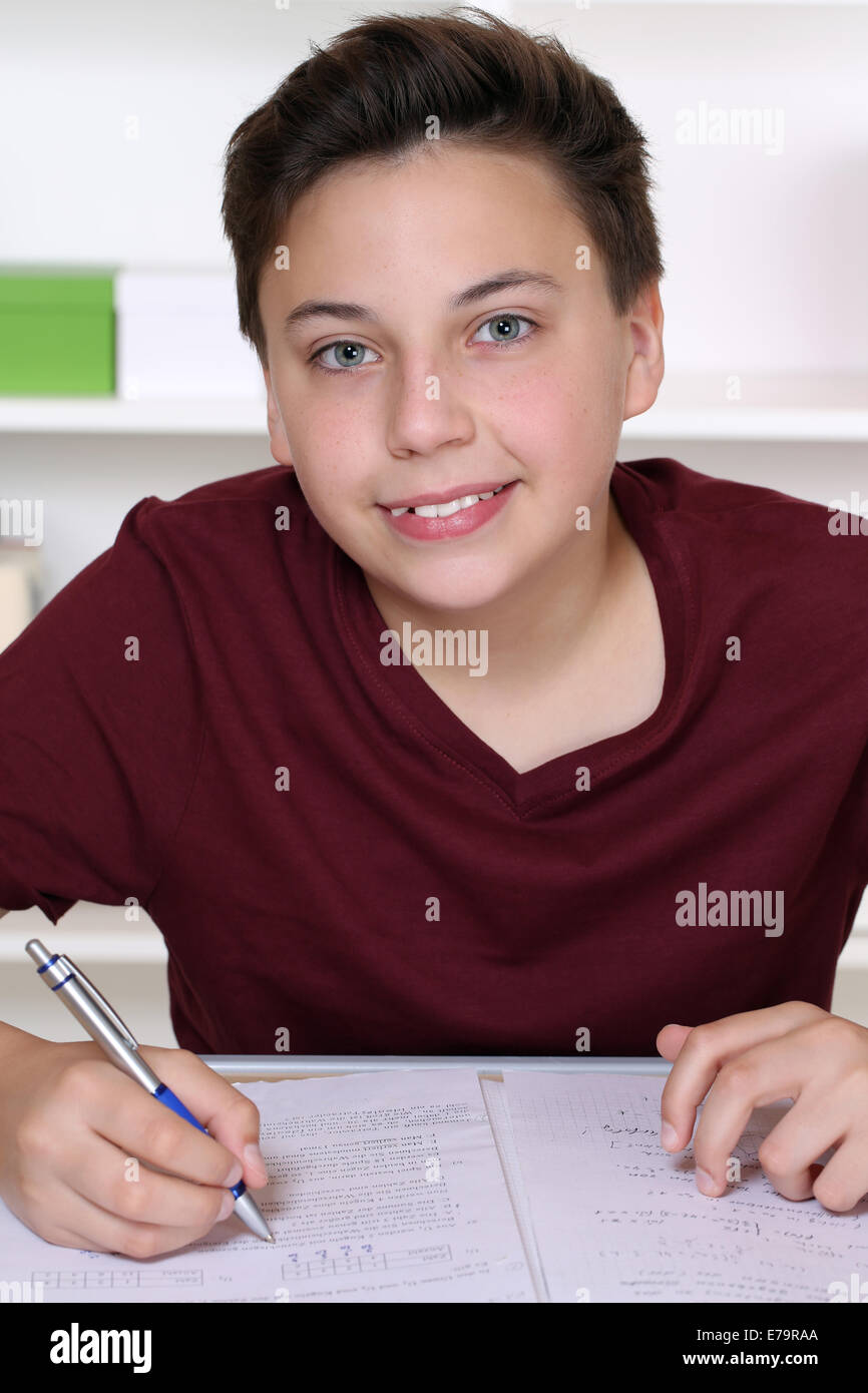 Student writing in book hi-res stock photography and images - Alamy