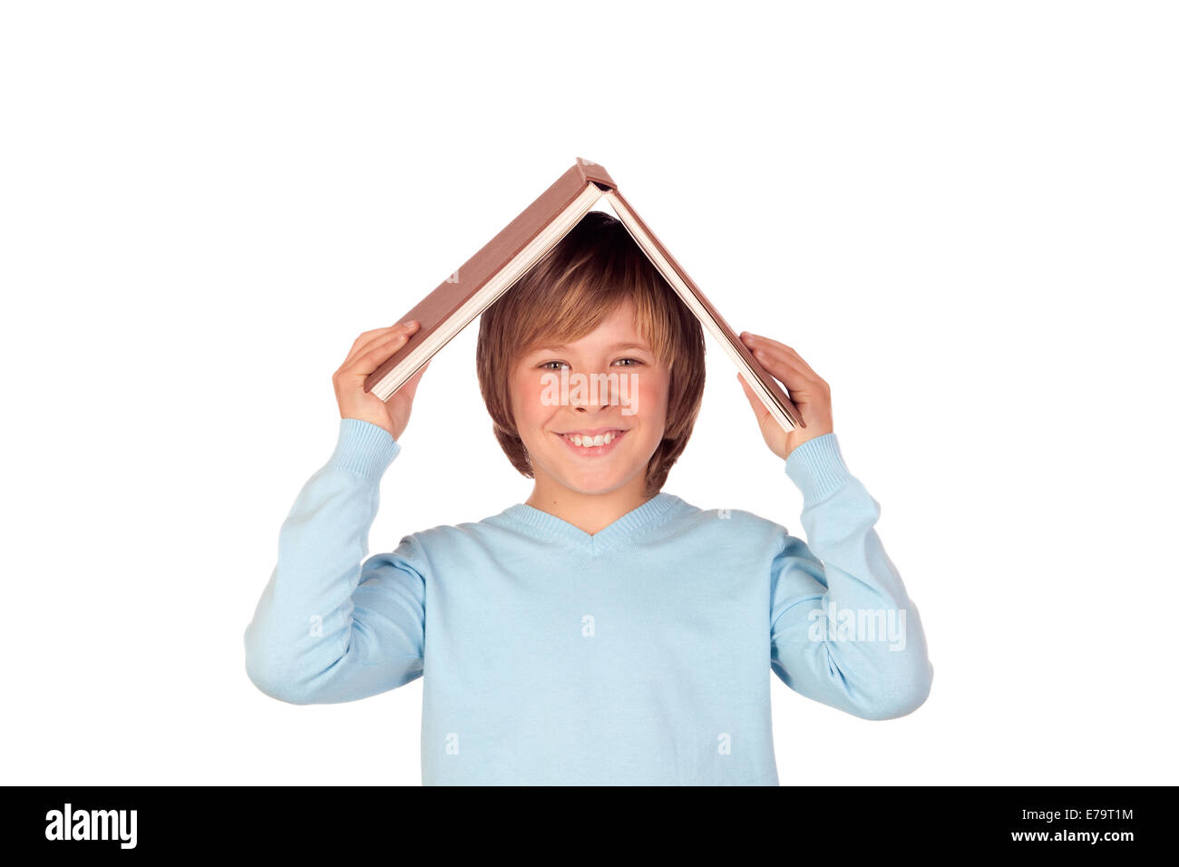 Preteen boy with a big book oh his head isolated on white background ...