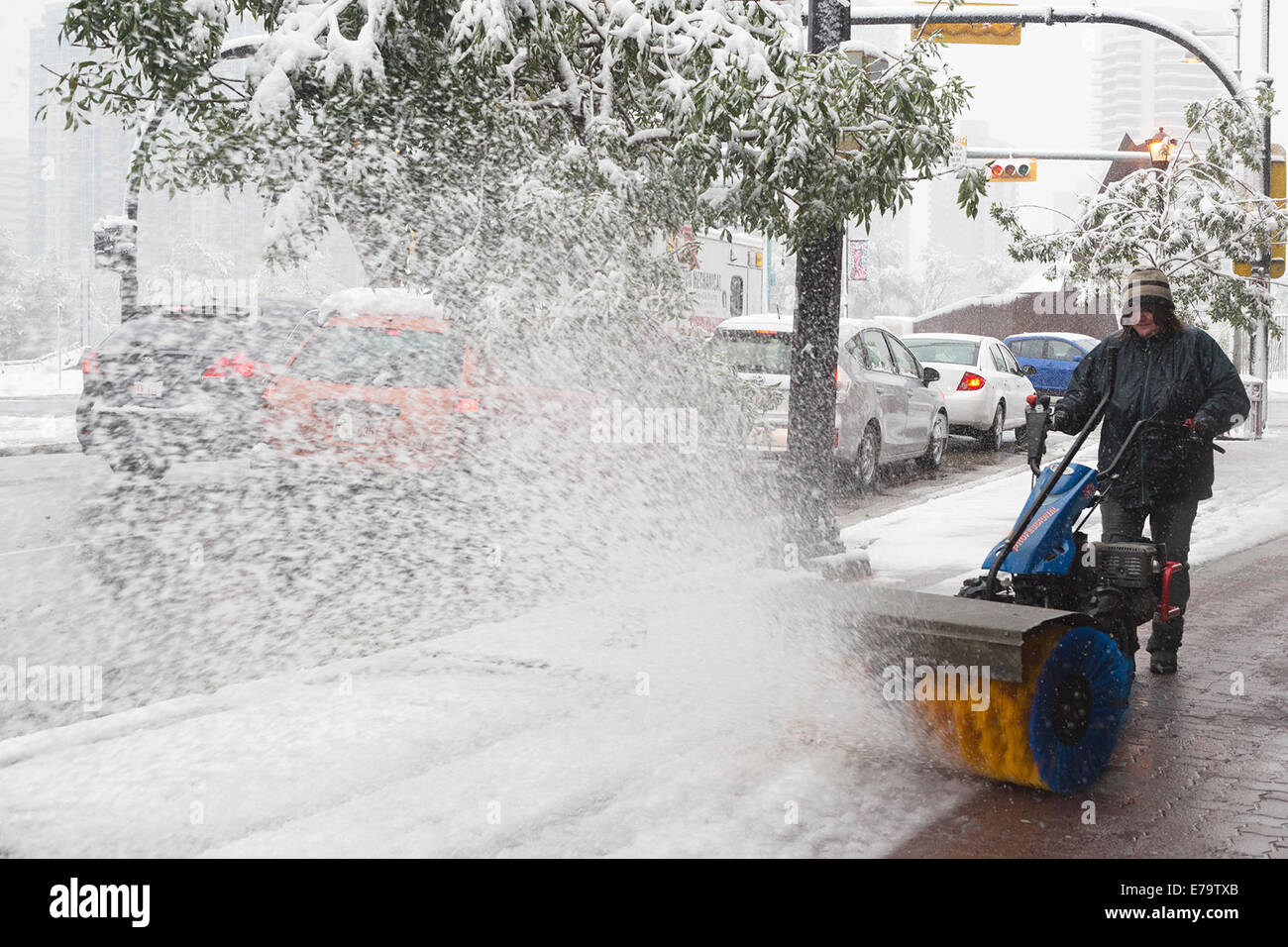 Woman clears snow from hi-res stock photography and images - Alamy