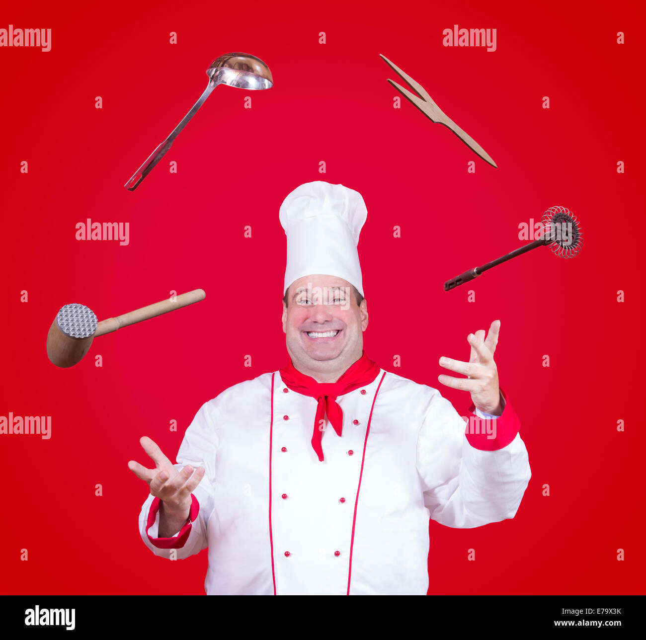 cheerful cook juggle with cooking utensils Stock Photo - Alamy
