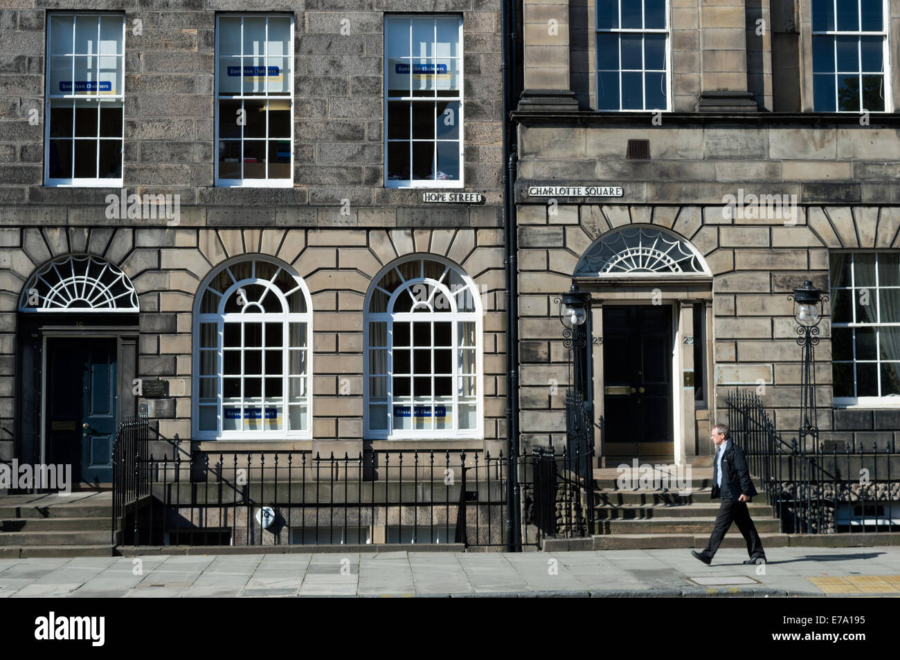 Man walking past traditional architecture hi-res stock photography and ...