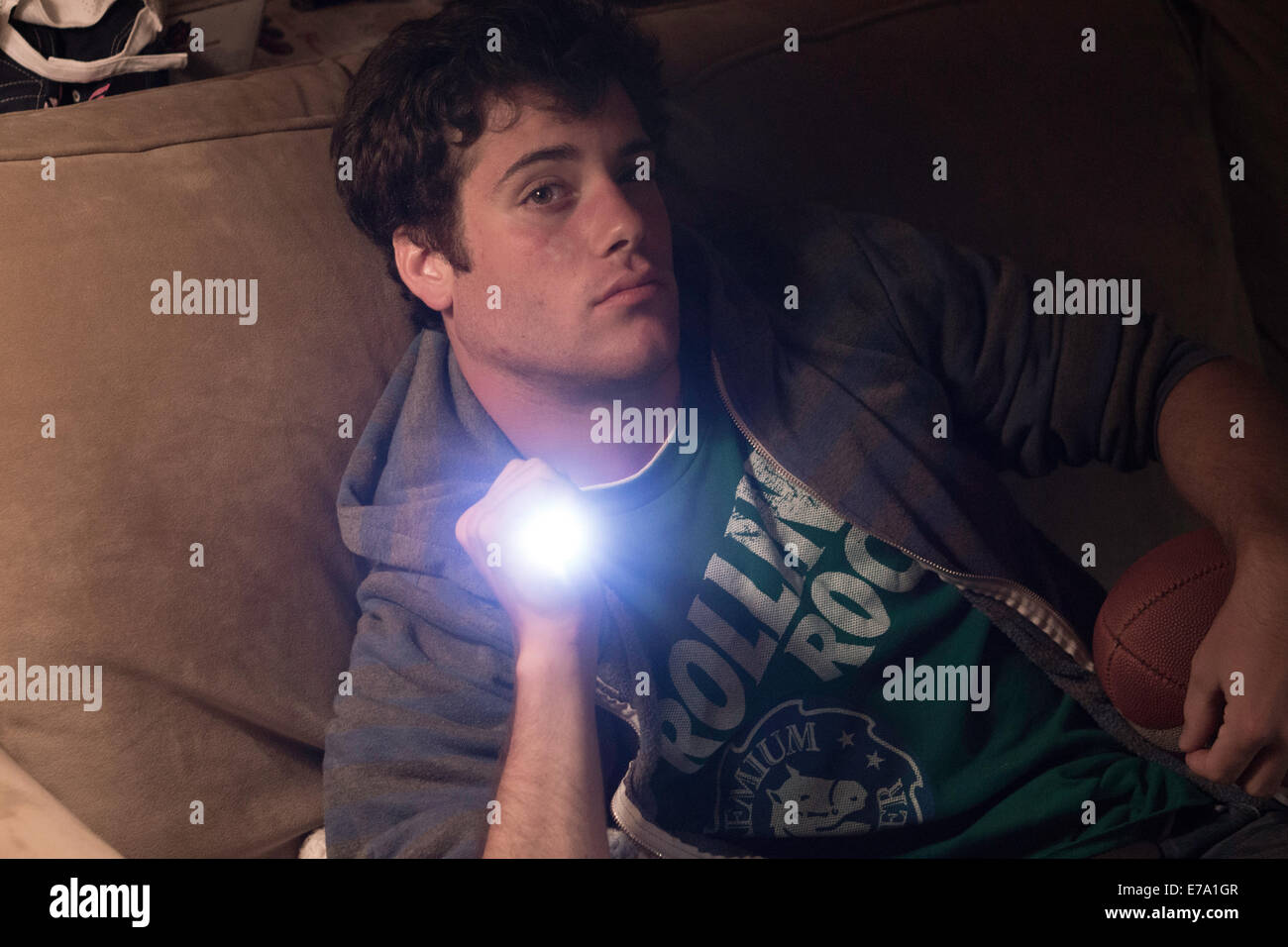 Man shining light at camera Stock Photo - Alamy