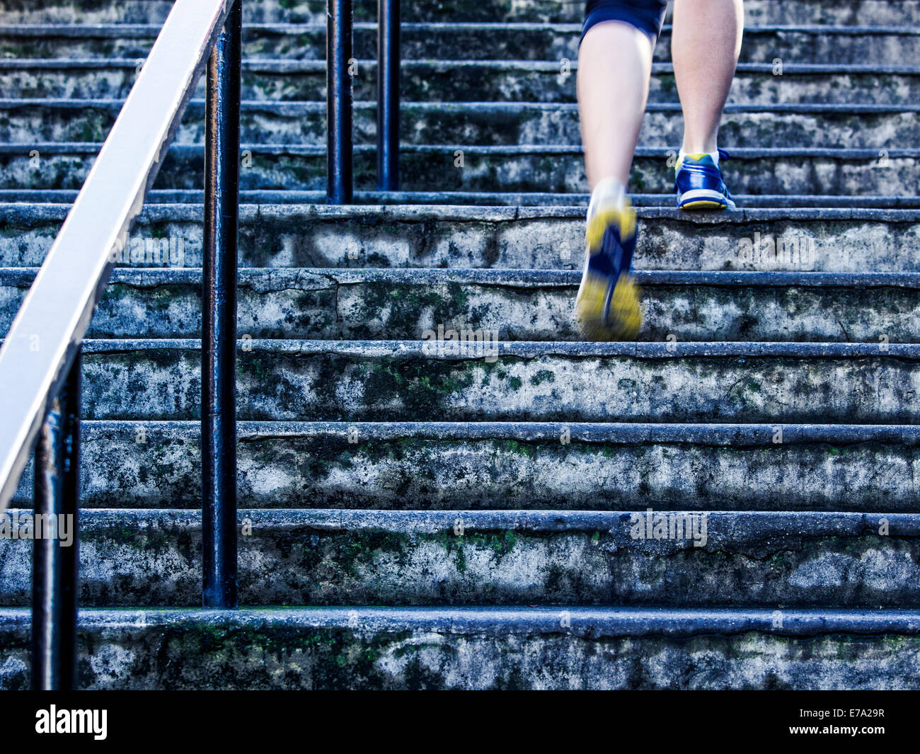 Legs of person running up San Francisco's Lyon Street steps as a form ...
