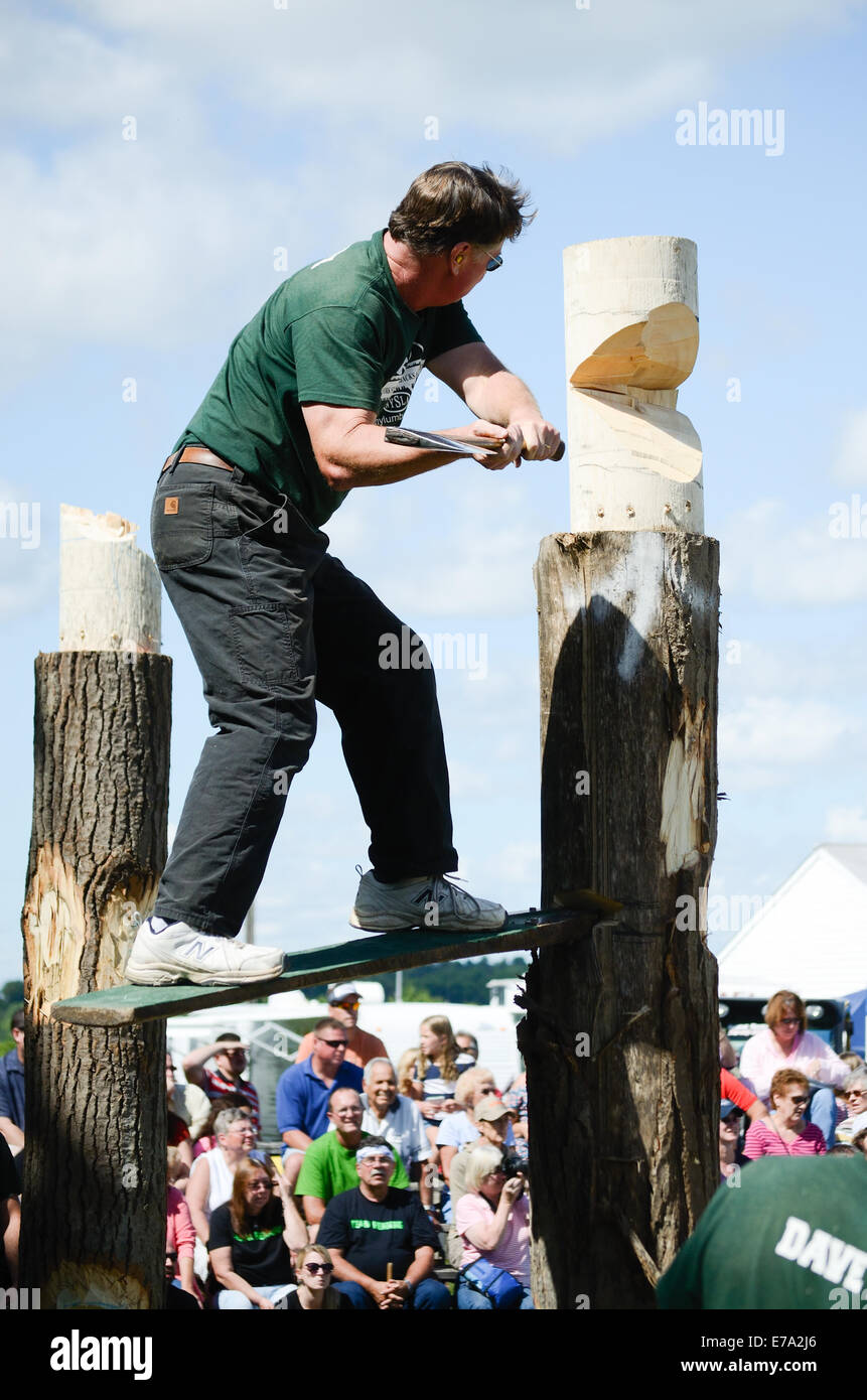 Man stands on spring board to compete in horizontal chopping event ...