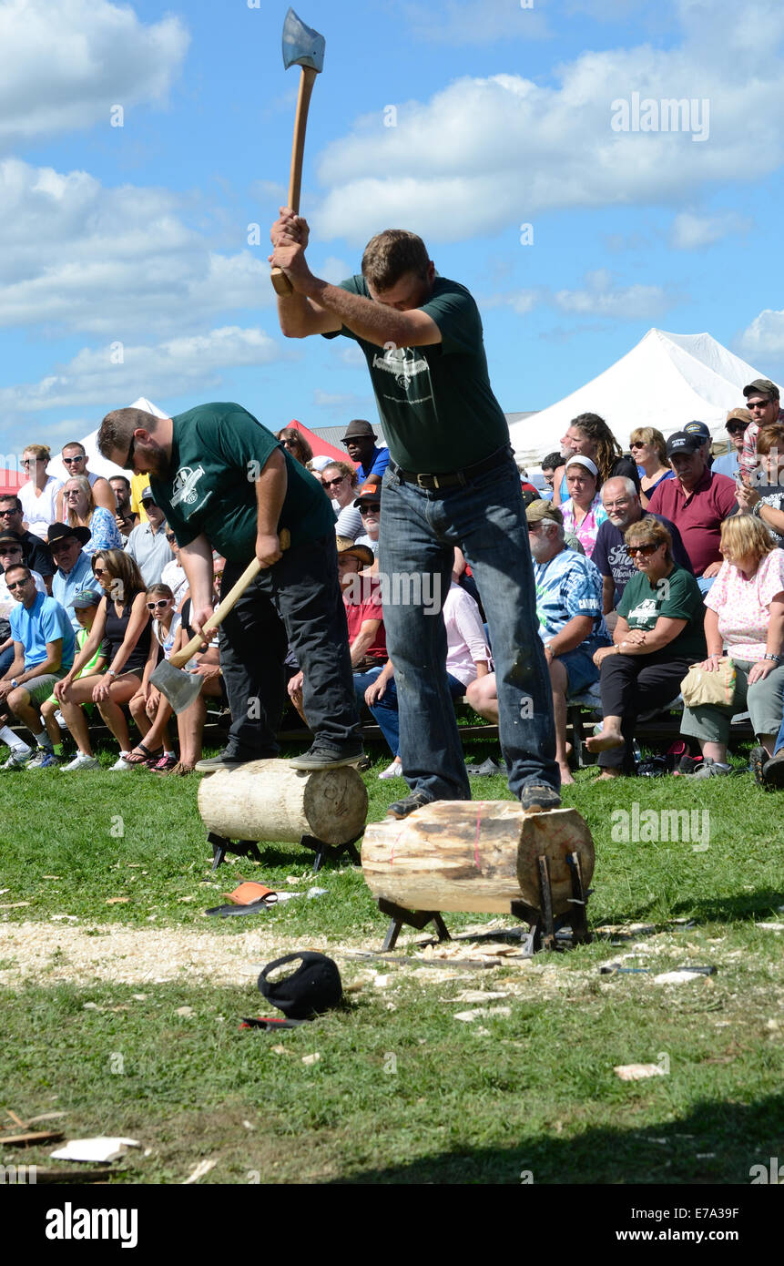 Lumberjacks compete in horizontal log chopping event Stock Photo - Alamy