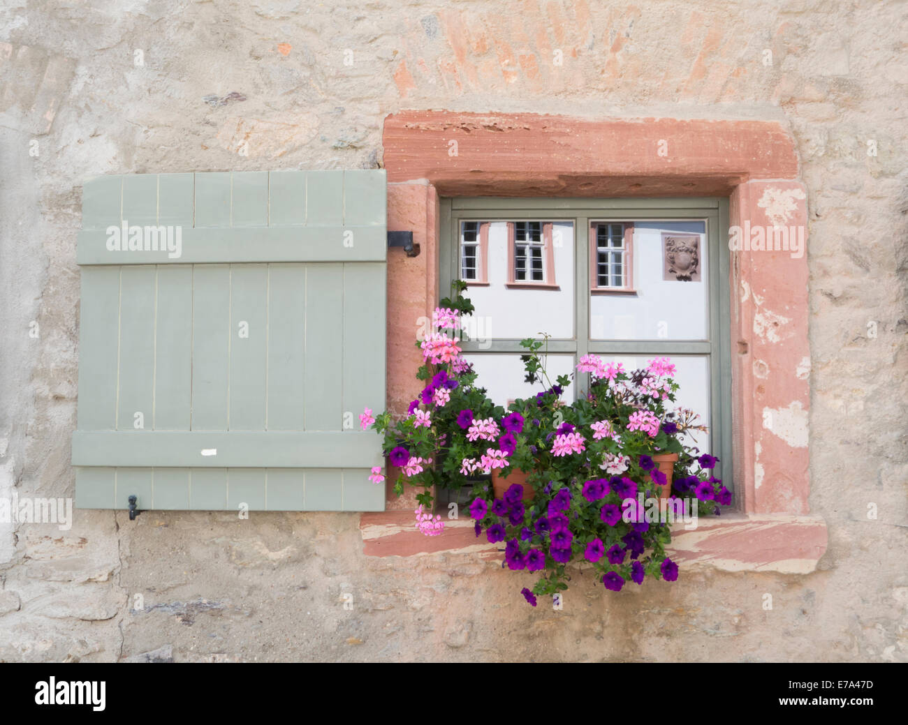 Attractive old German shuttered window and flower boxes Stock Photo - Alamy