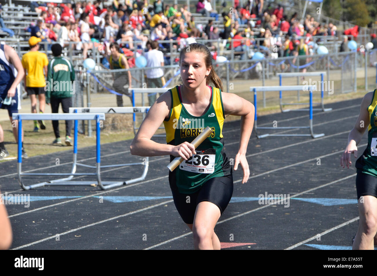 girl running in a relay race Stock Photo - Alamy