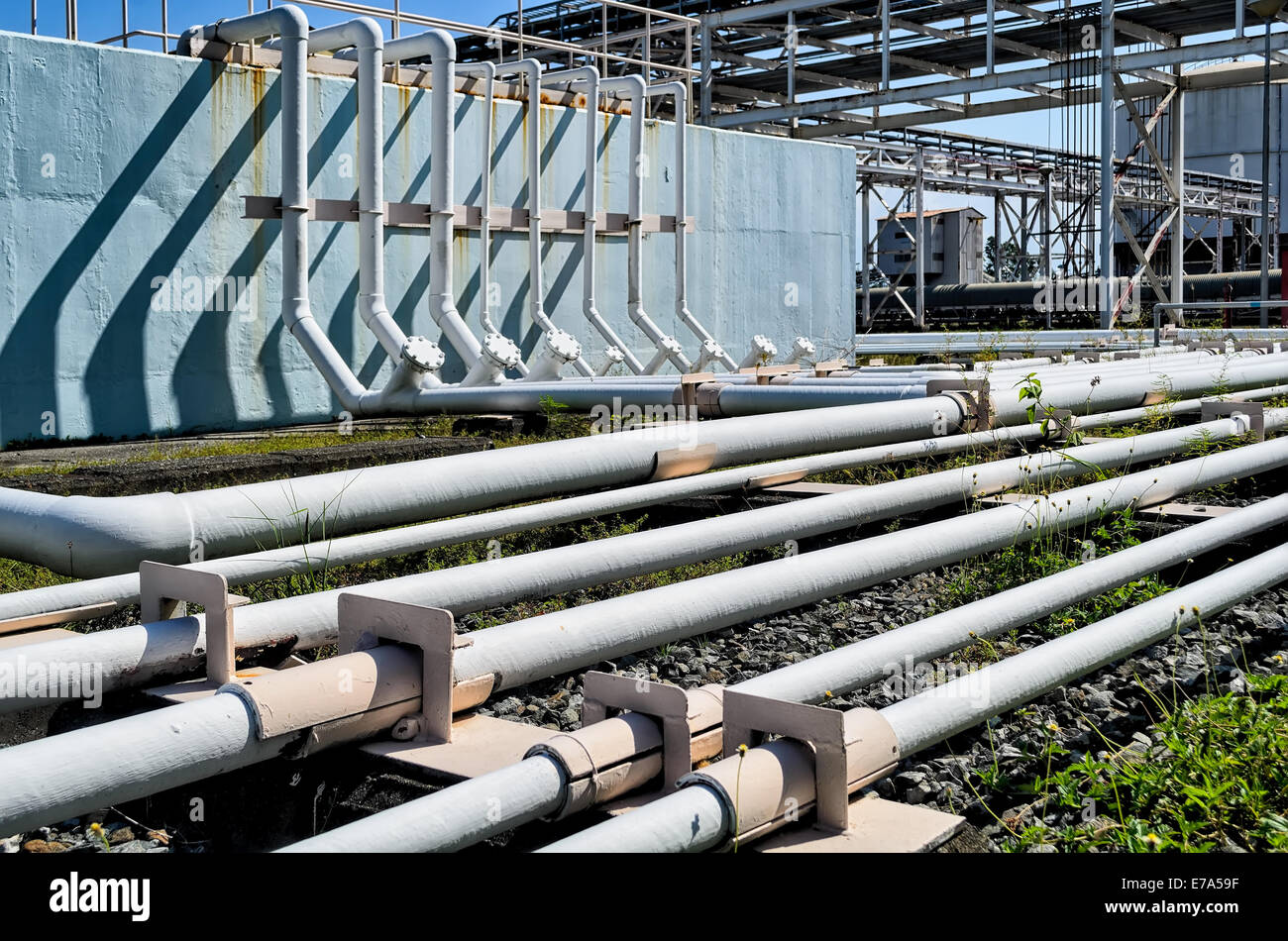 White power plant ground pipes Stock Photo - Alamy