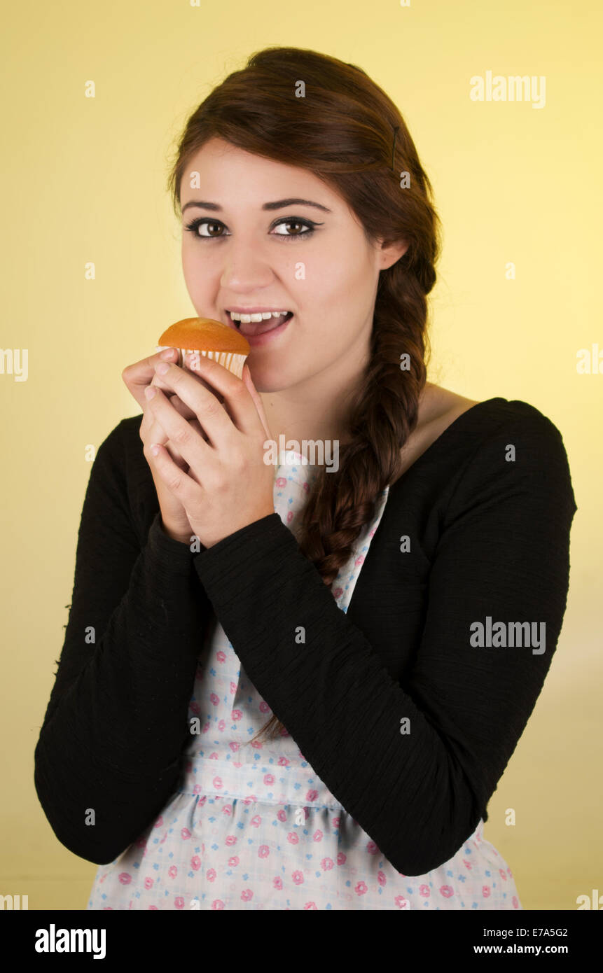 Happy pretty young girl wearing cooking apron Stock Photo - Alamy