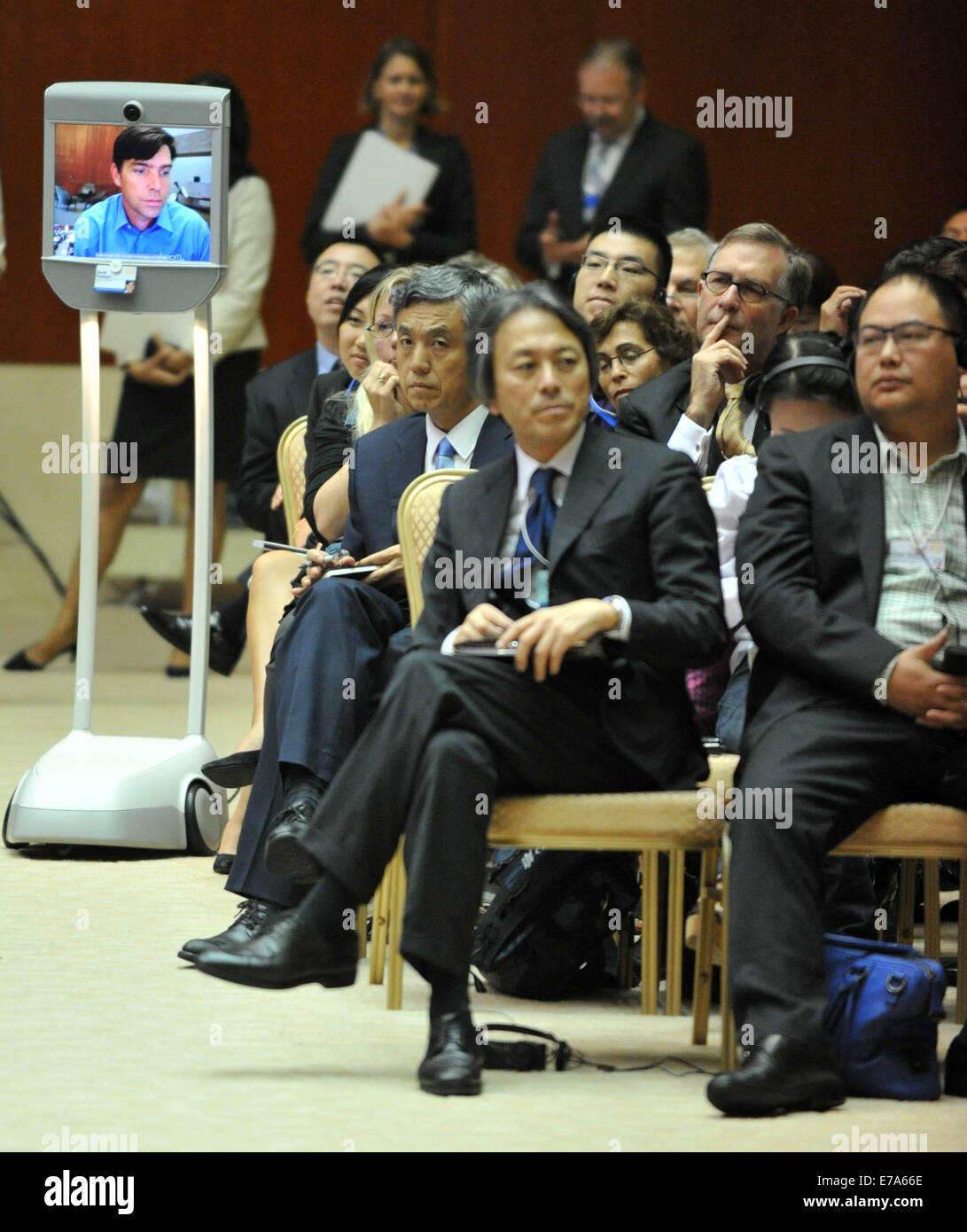 Tianjin, China. 11th Sep, 2014. Delegates talk with Scott Hassan, CEO ...