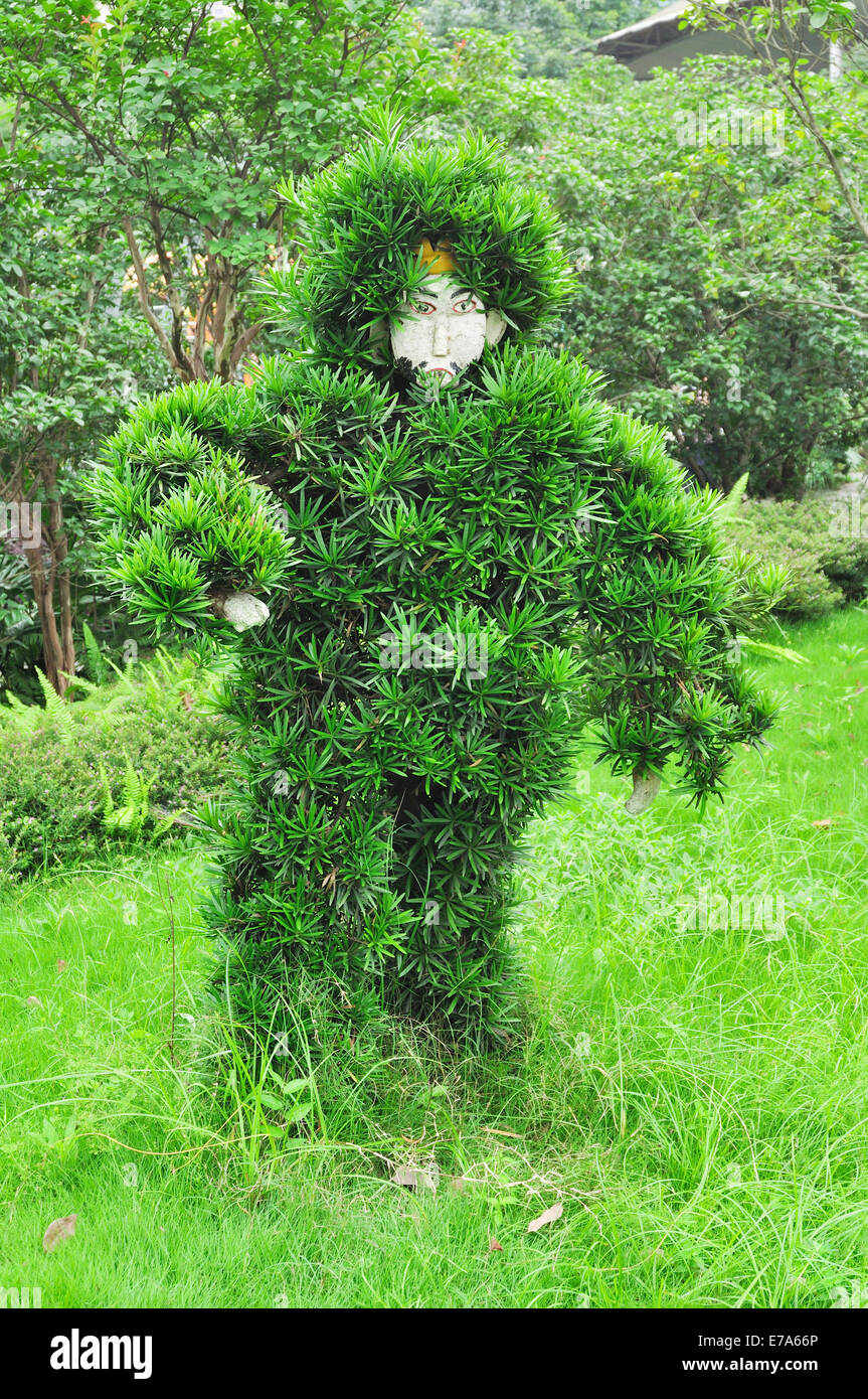 Hedge shaped like Monkey King Stock Photo - Alamy