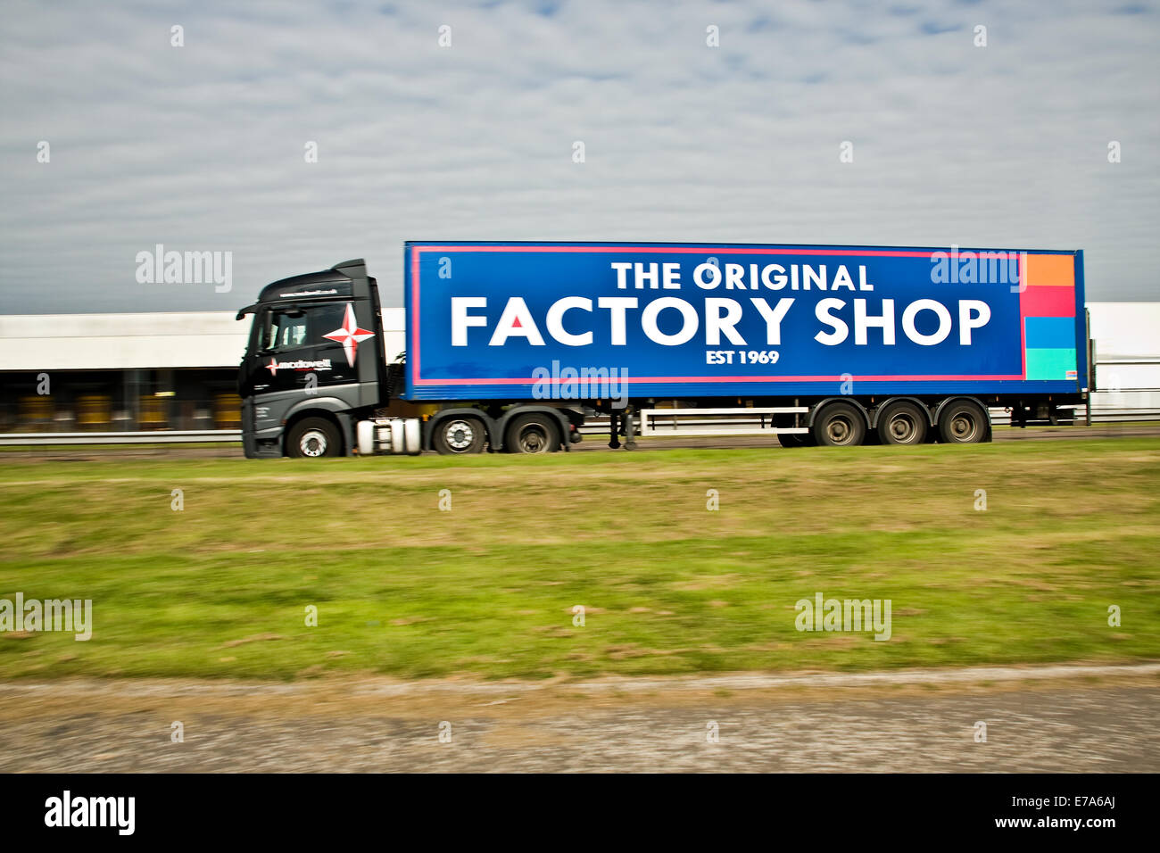 The Original Factory Shop articulated lorry travelling along the ...