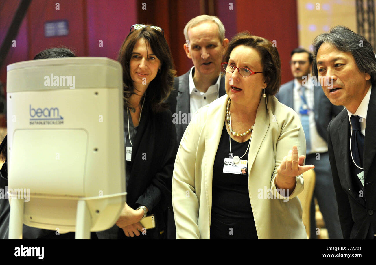 Tianjin, China. 11th Sep, 2014. Delegates talk with Scott Hassan, CEO ...