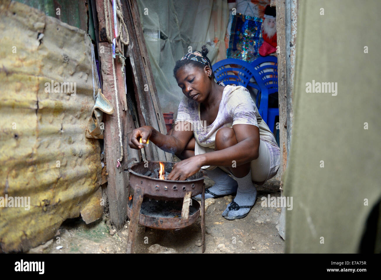 Poor woman cooking hi-res stock photography and images - Alamy