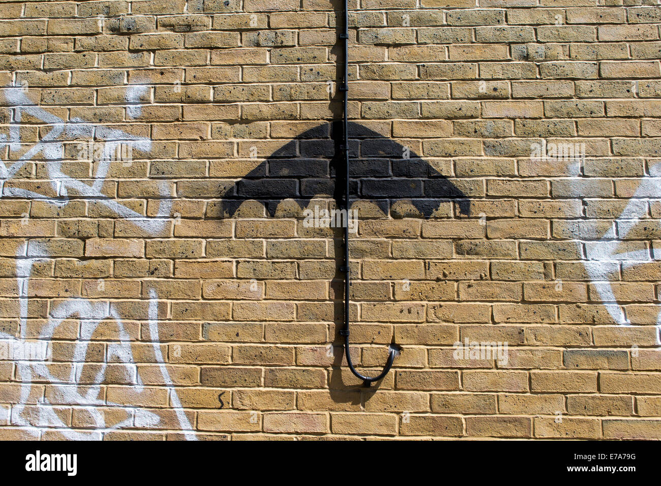 Umbrella Graffiti created around a cable, St Matthew's Row, Shoreditch ...