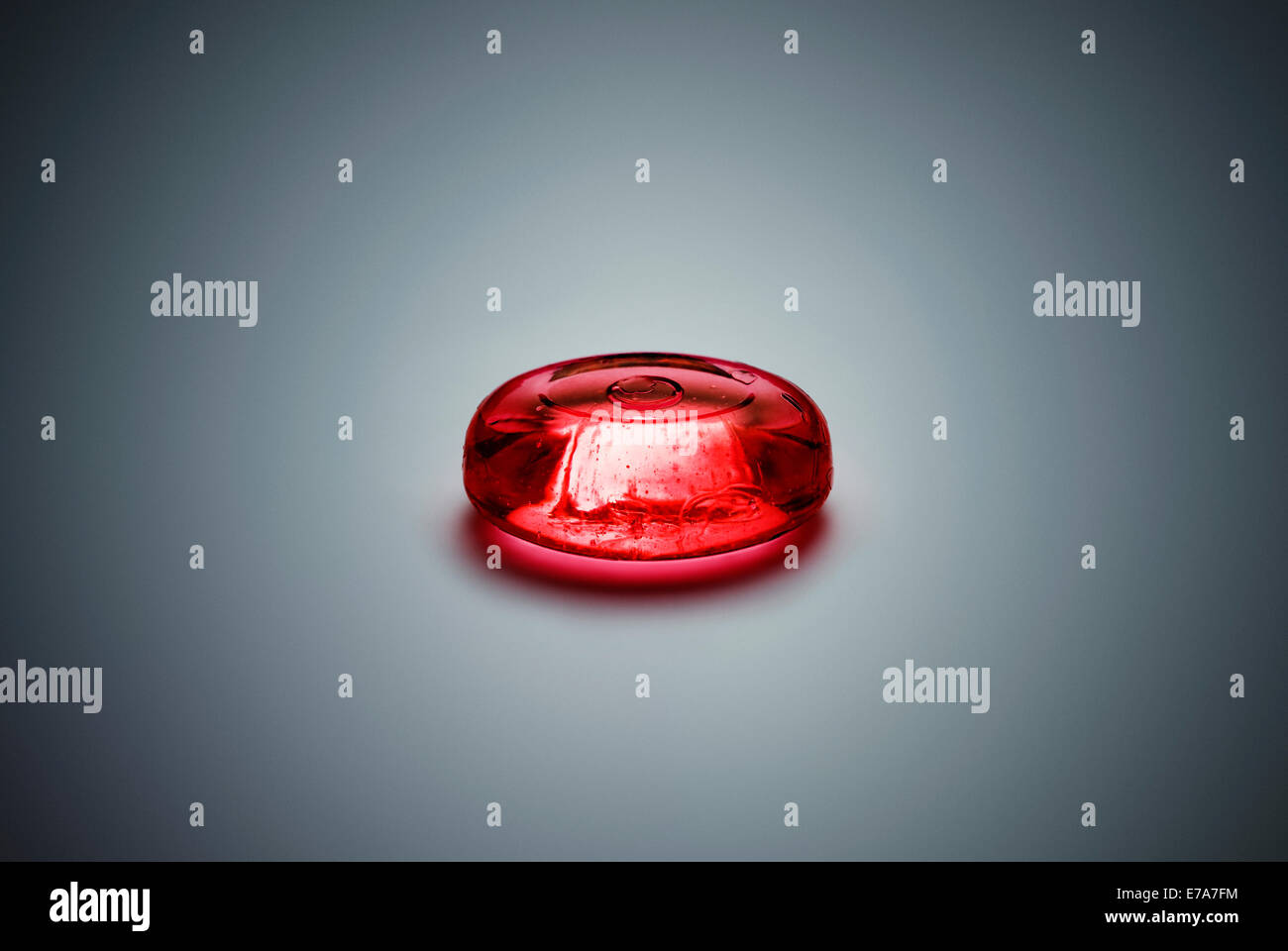 A piece of red hard candy Stock Photo - Alamy
