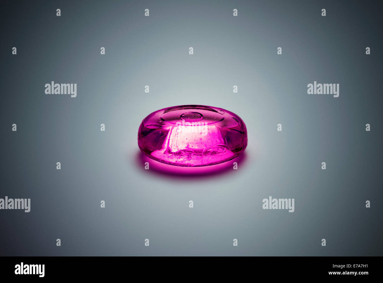 A piece of purple hard candy Stock Photo - Alamy