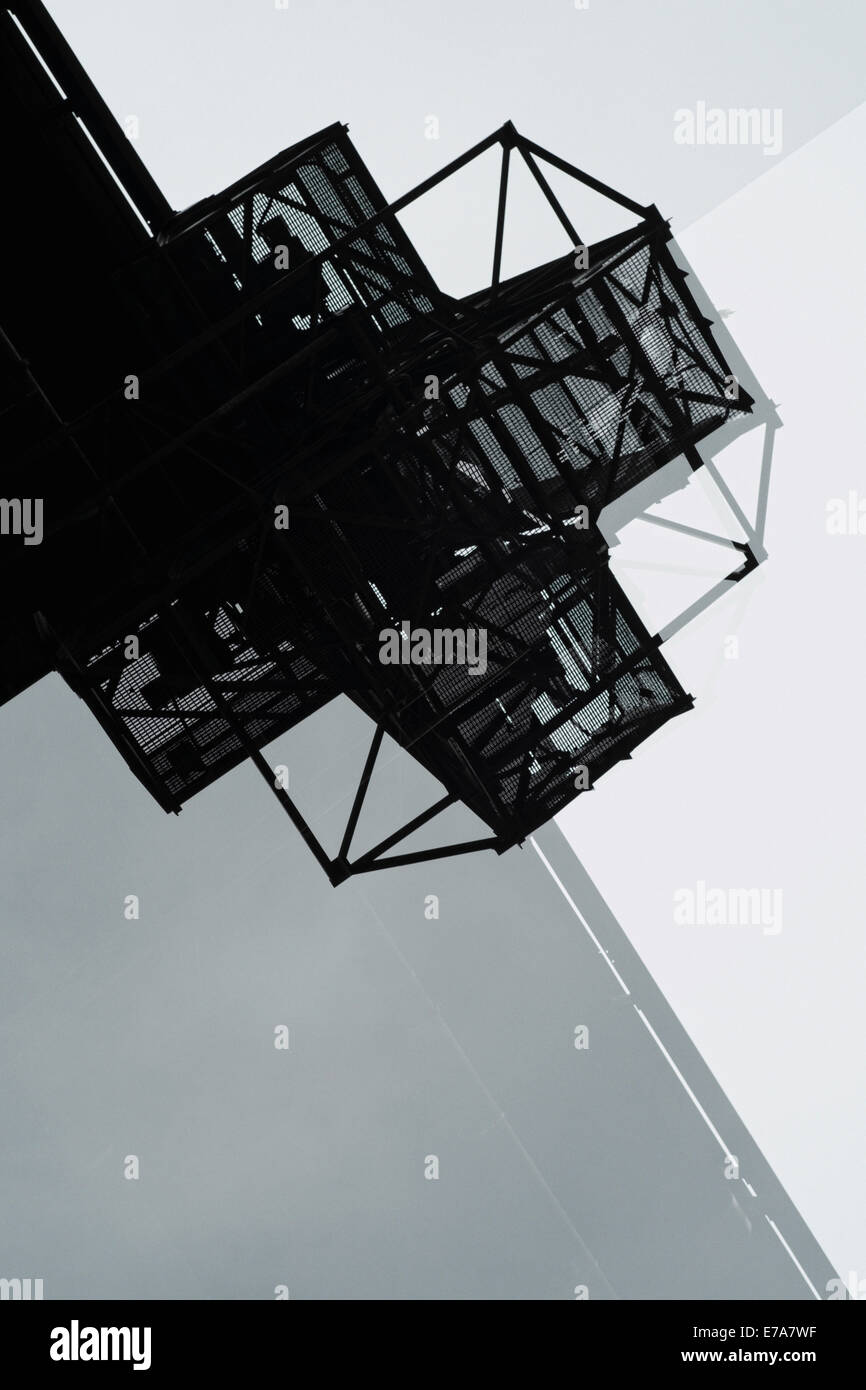 Below an outdoor fire escape, in double exposure Stock Photo - Alamy