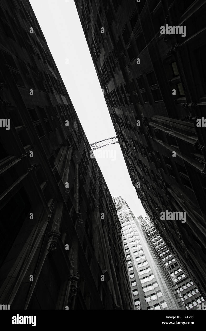 Distant view of footbridge between two building facades in Financial ...