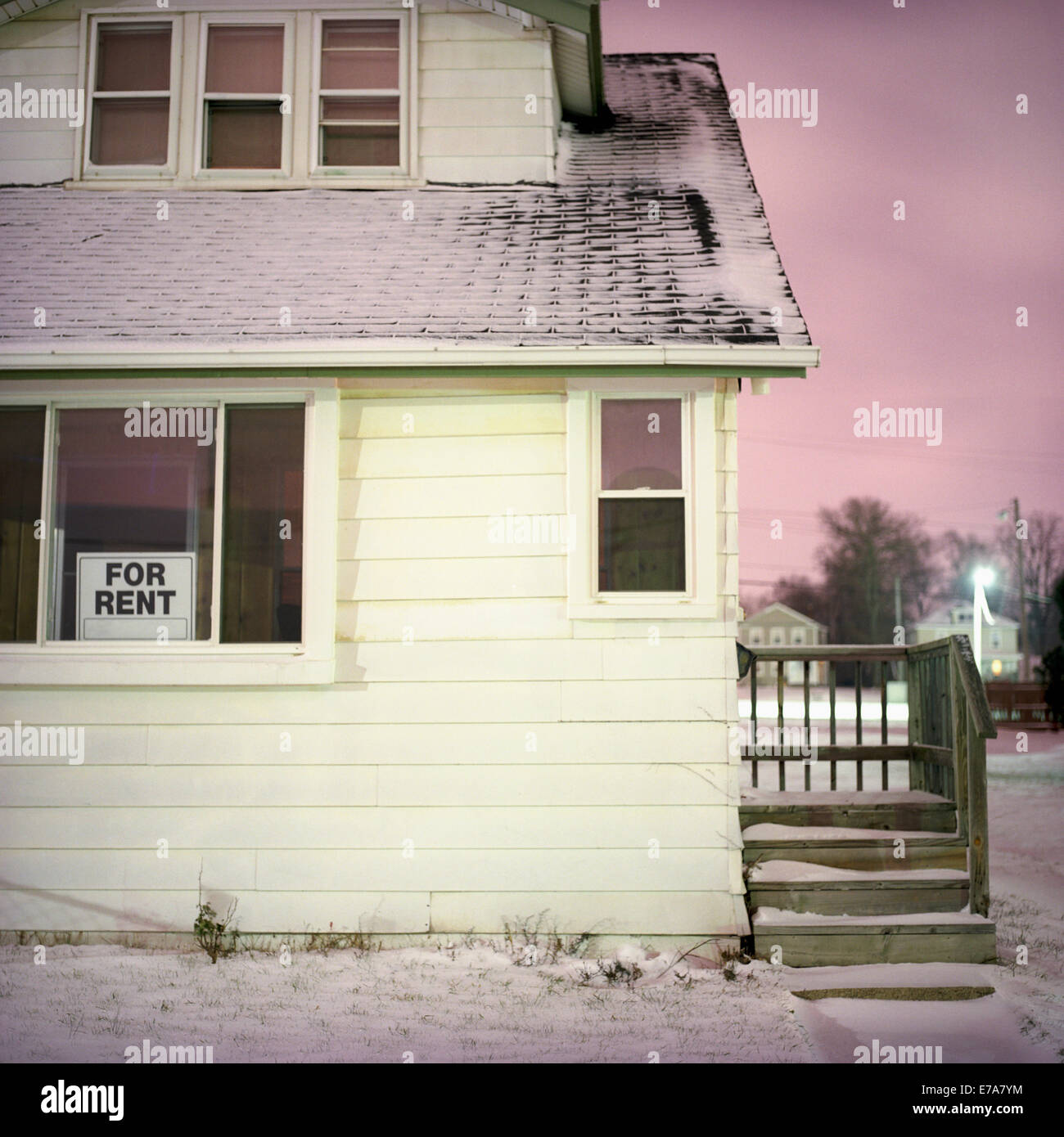 A For Rent Sign, in the window of a white house at night, long exposure ...