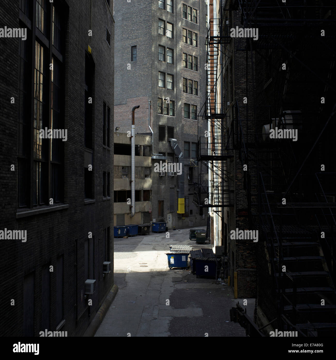 View of an alley and city buildings Stock Photo - Alamy