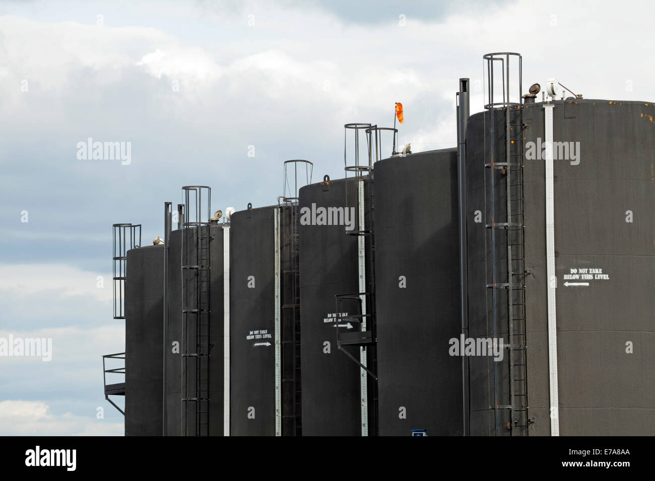 Row of oil storage tanks for cold heavy oil production with sand (CHOPS ...