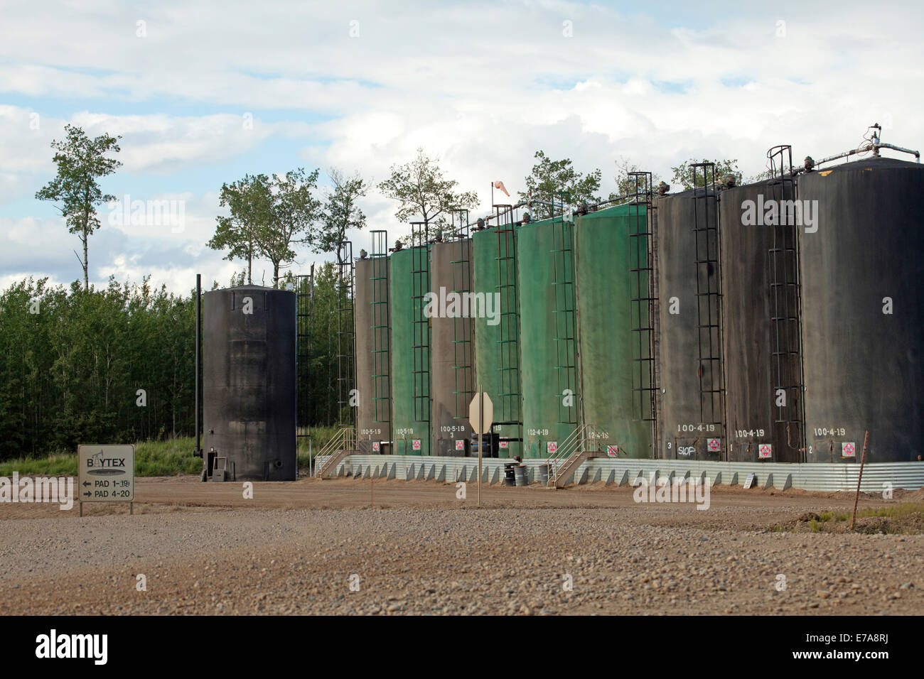 Row of oil storage tanks for cold heavy oil production with sand (CHOPS ...